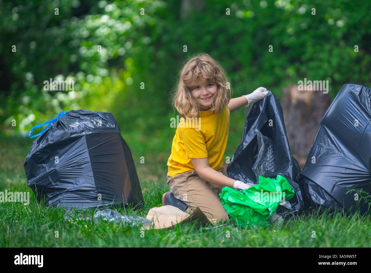 Child collecting trash outside. Ecology concept. Environmental ...