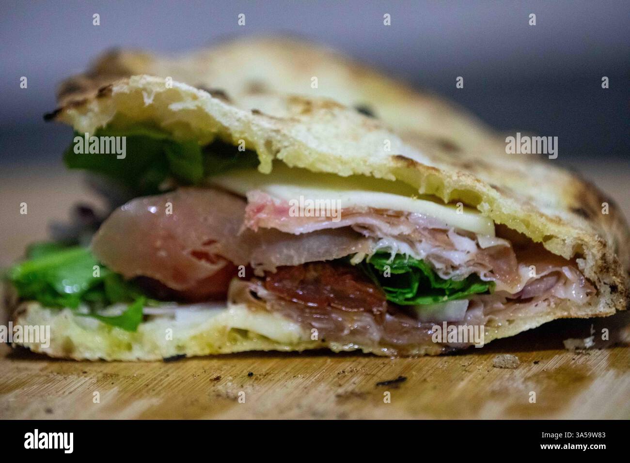 Traditional Italian Neapolitan panuozzo prepared with artisanal pizza ...