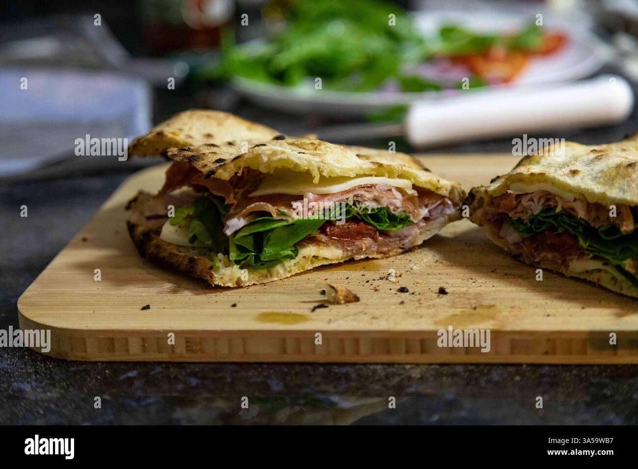 Traditional Italian Neapolitan panuozzo prepared with artisanal pizza ...