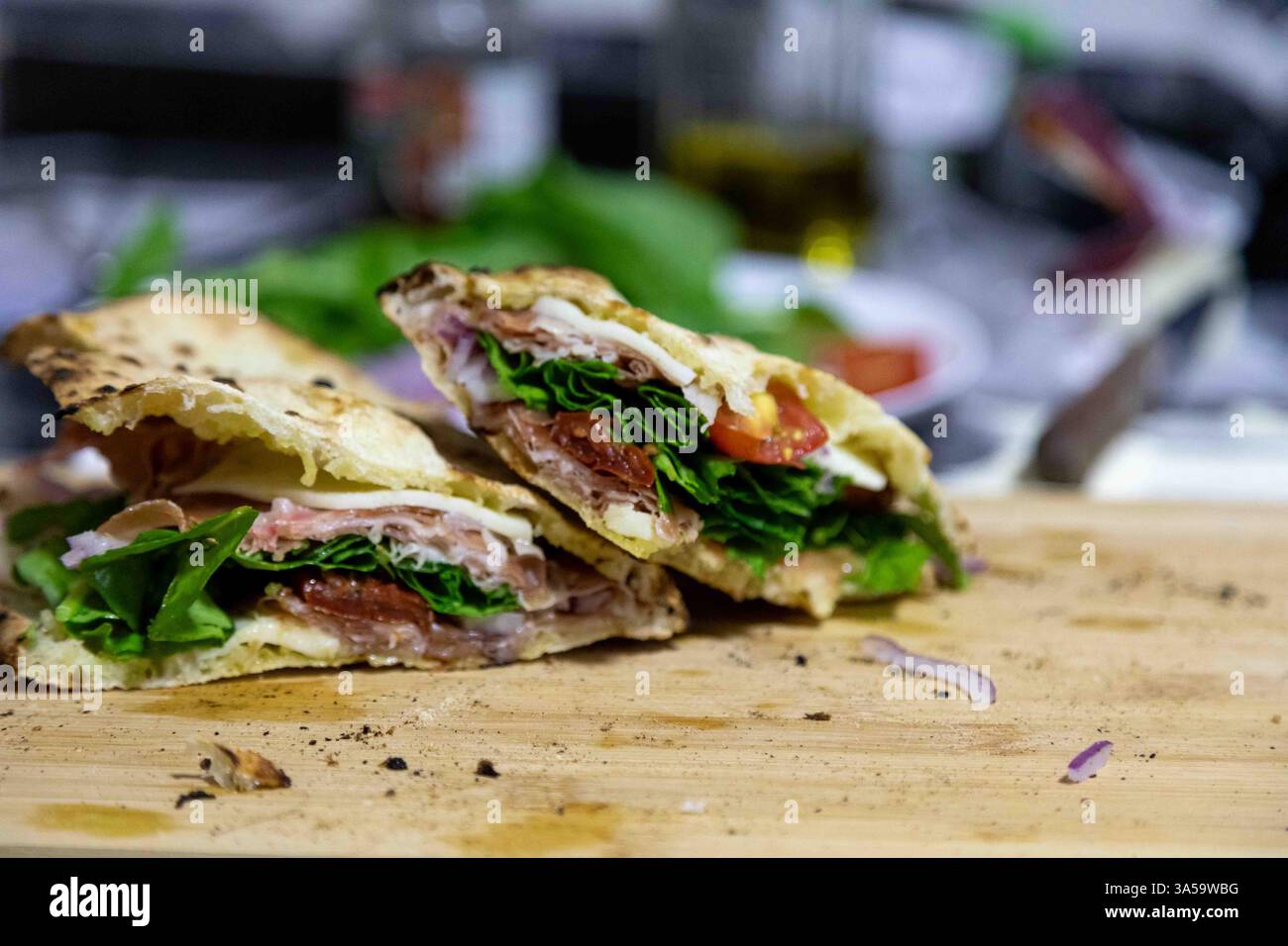 Traditional Italian Neapolitan panuozzo prepared with artisanal pizza ...