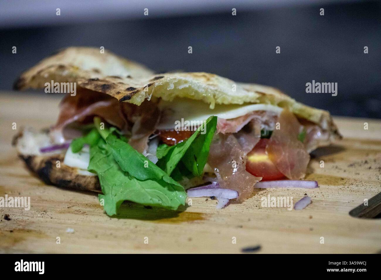 Traditional Italian Neapolitan panuozzo prepared with artisanal pizza ...