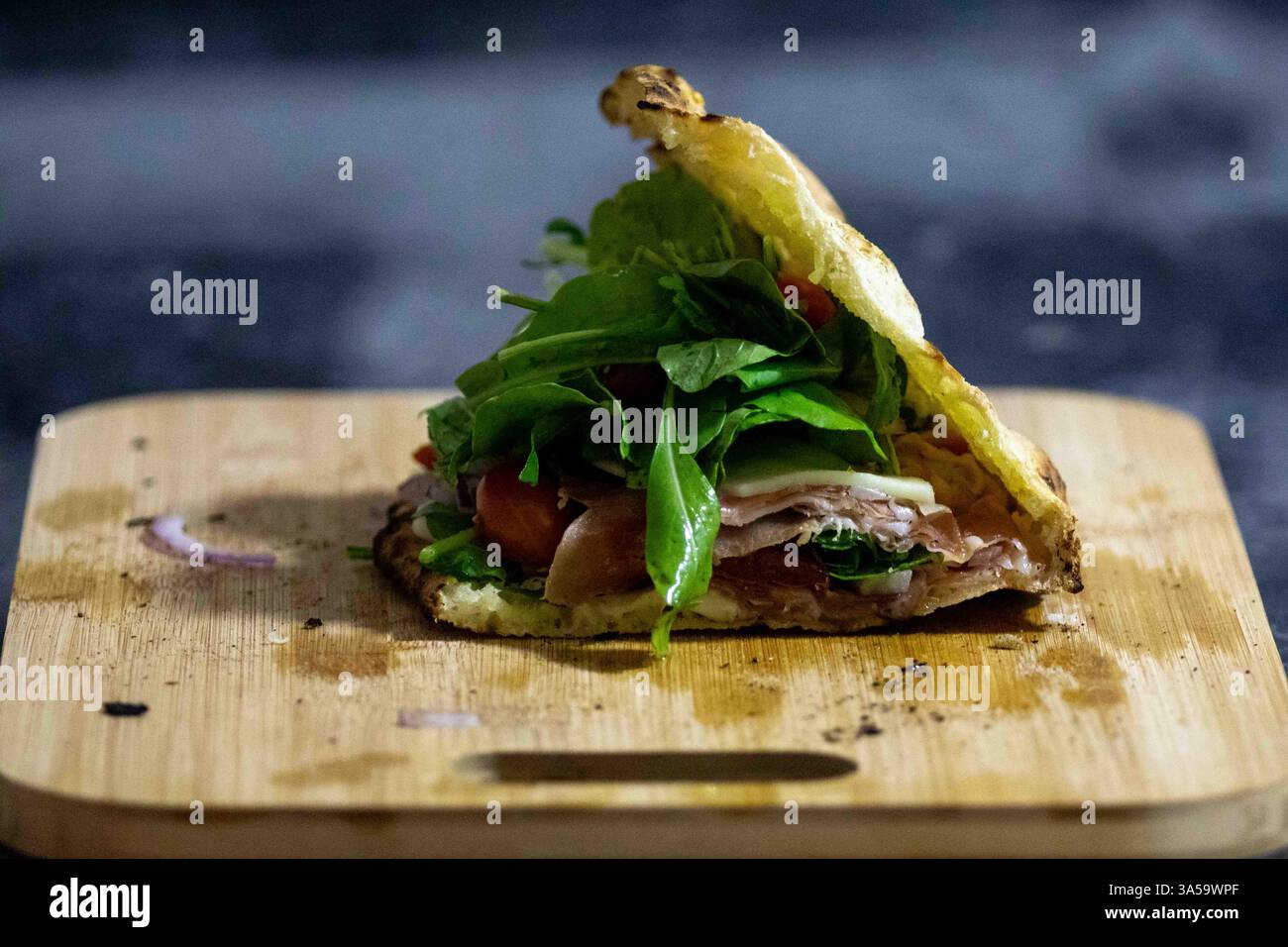 Traditional Italian Neapolitan panuozzo prepared with artisanal pizza ...