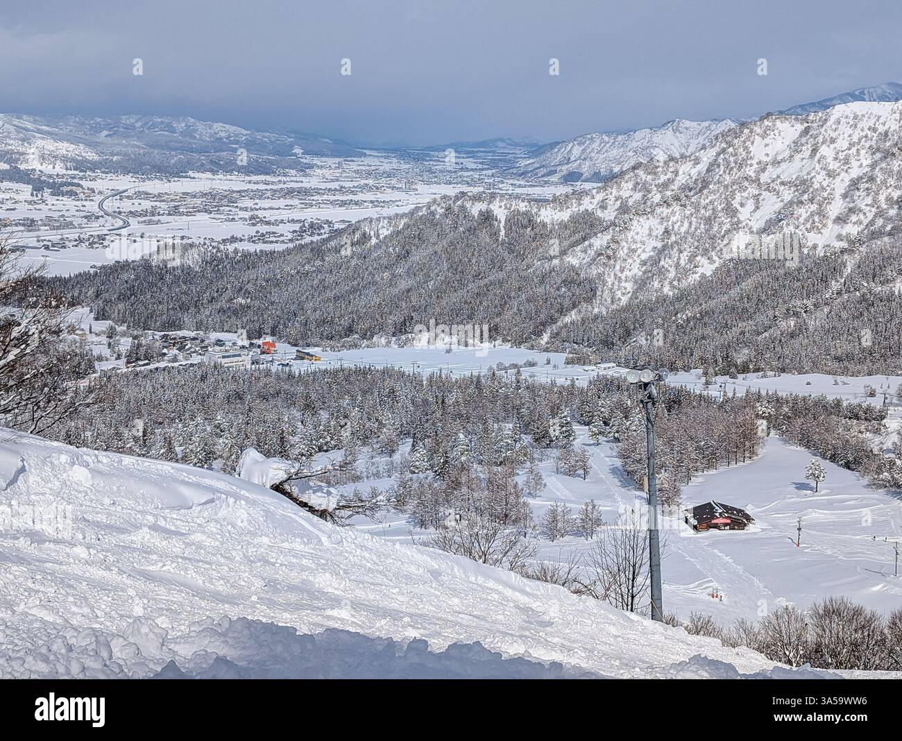 Winter landscape with snow covered mountains and forest. Maiko, Niigata ...