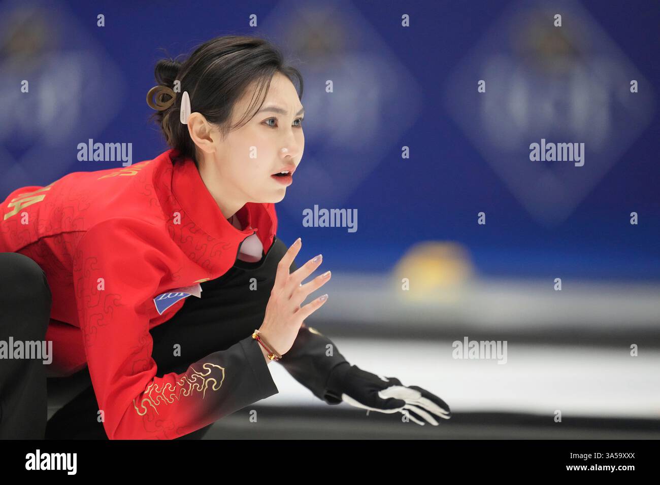China's Jiang Jiayi calls the sweep during the semifinal match against Switzerland at the World ...