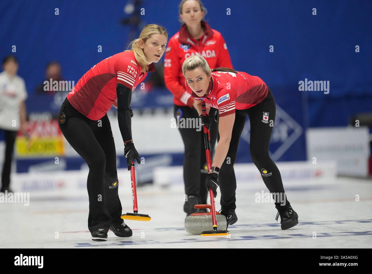 Canada's Emma Miskew, right, and Sarah Wilkes, left, sweep during the ...
