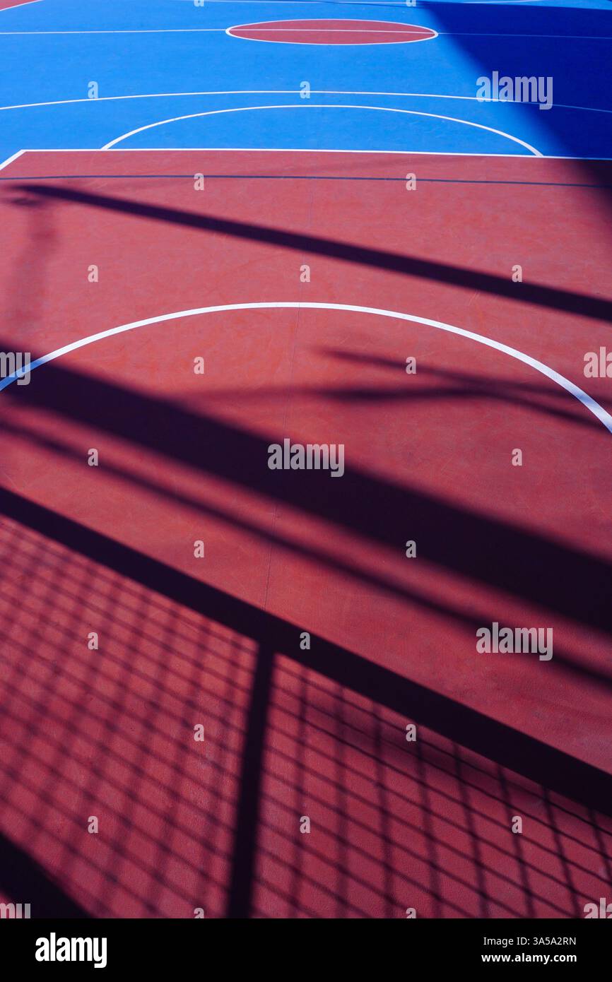 blue and red street basketball court on the street Stock Photo - Alamy