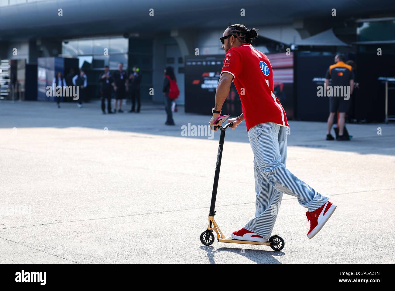 LEWIS HAMILTON (GBR) of Scuderia Ferrari #44 roaming around the paddock ...