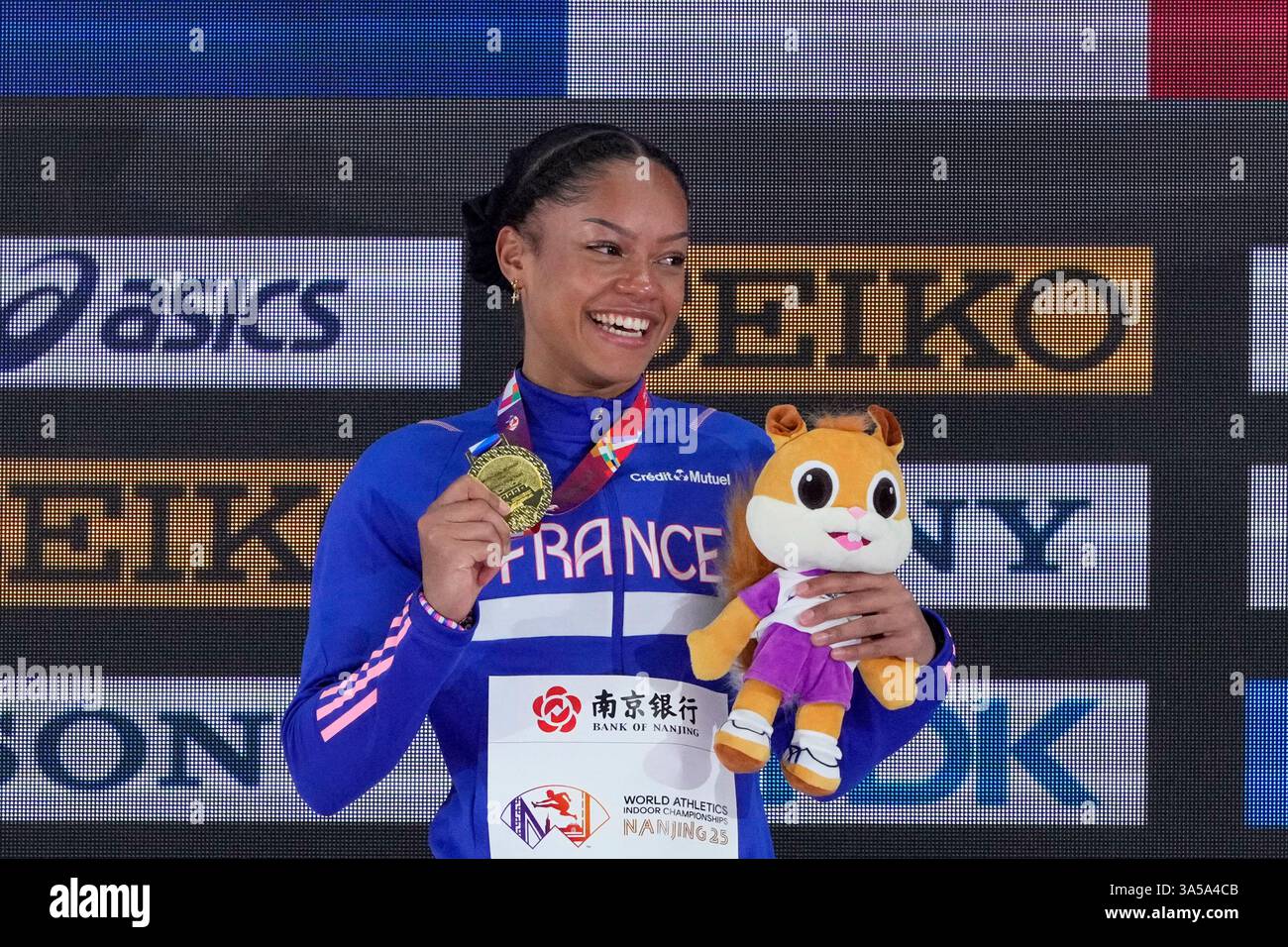 Marie-Julie Bonnin, of France, poses on the podium after winning the ...