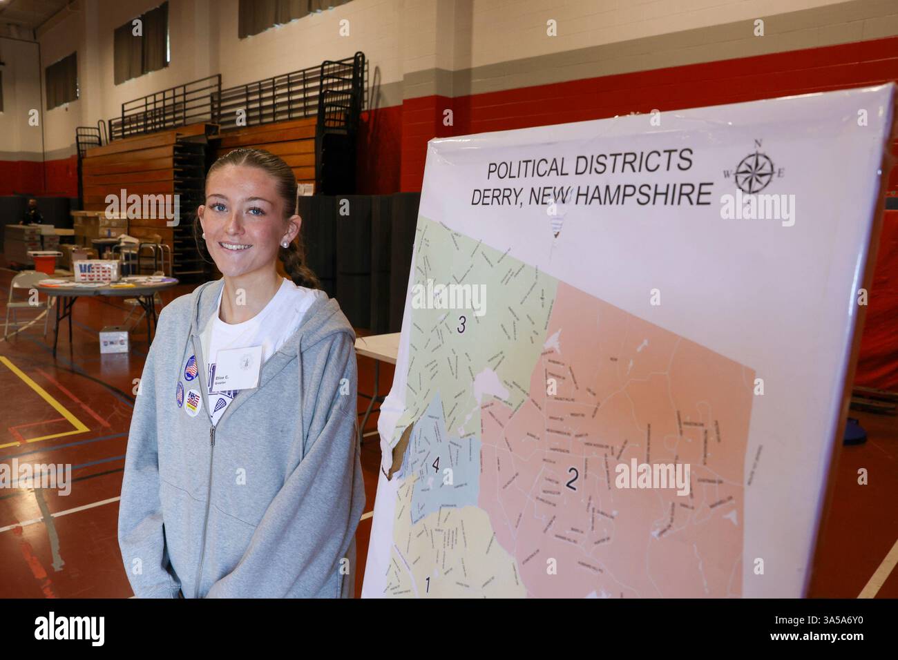 Election volunteer and first-time voter Elise Collins poses for a photo ...