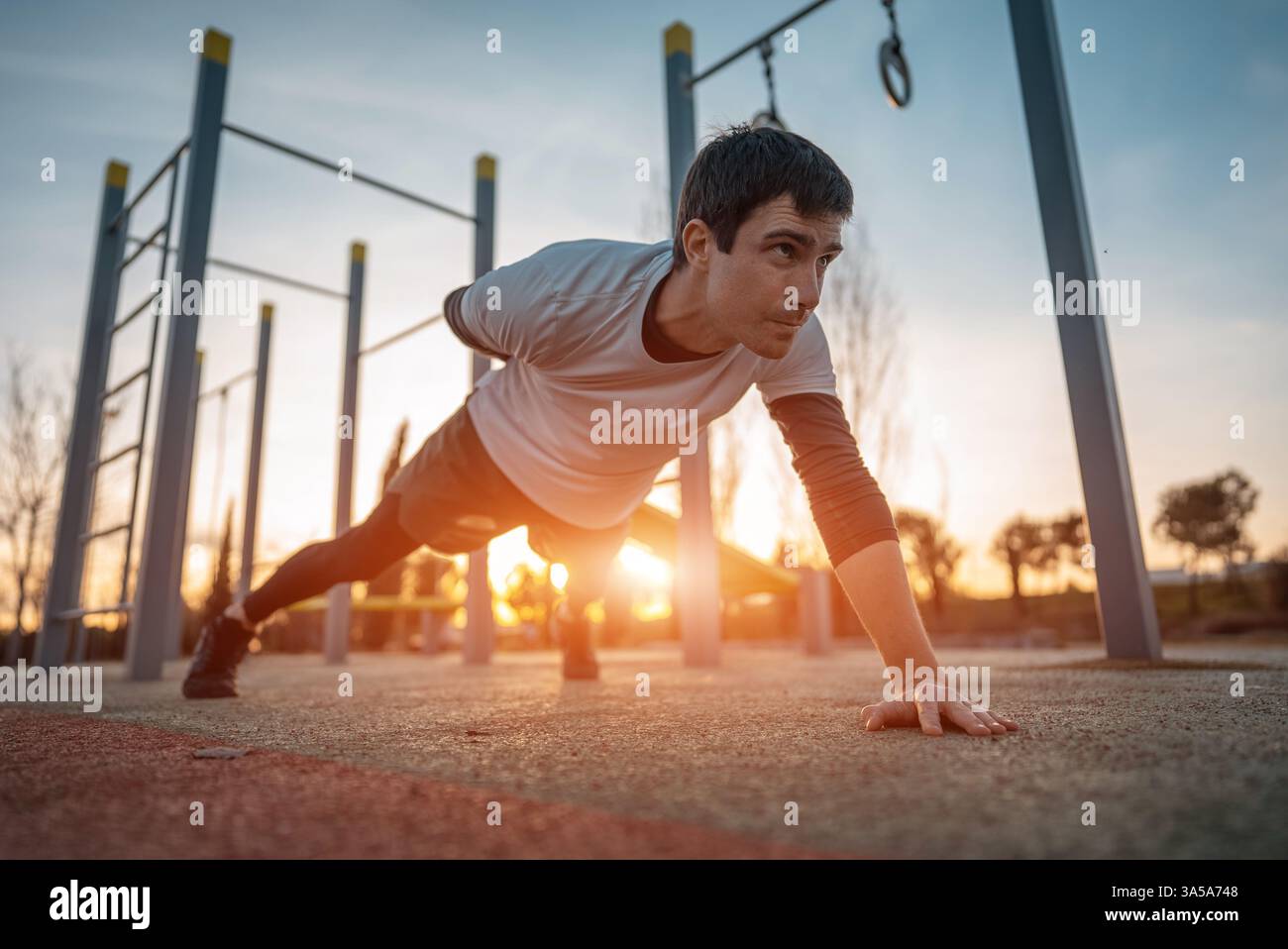 young athletic man exercising at fitness calisthenics workout and ...