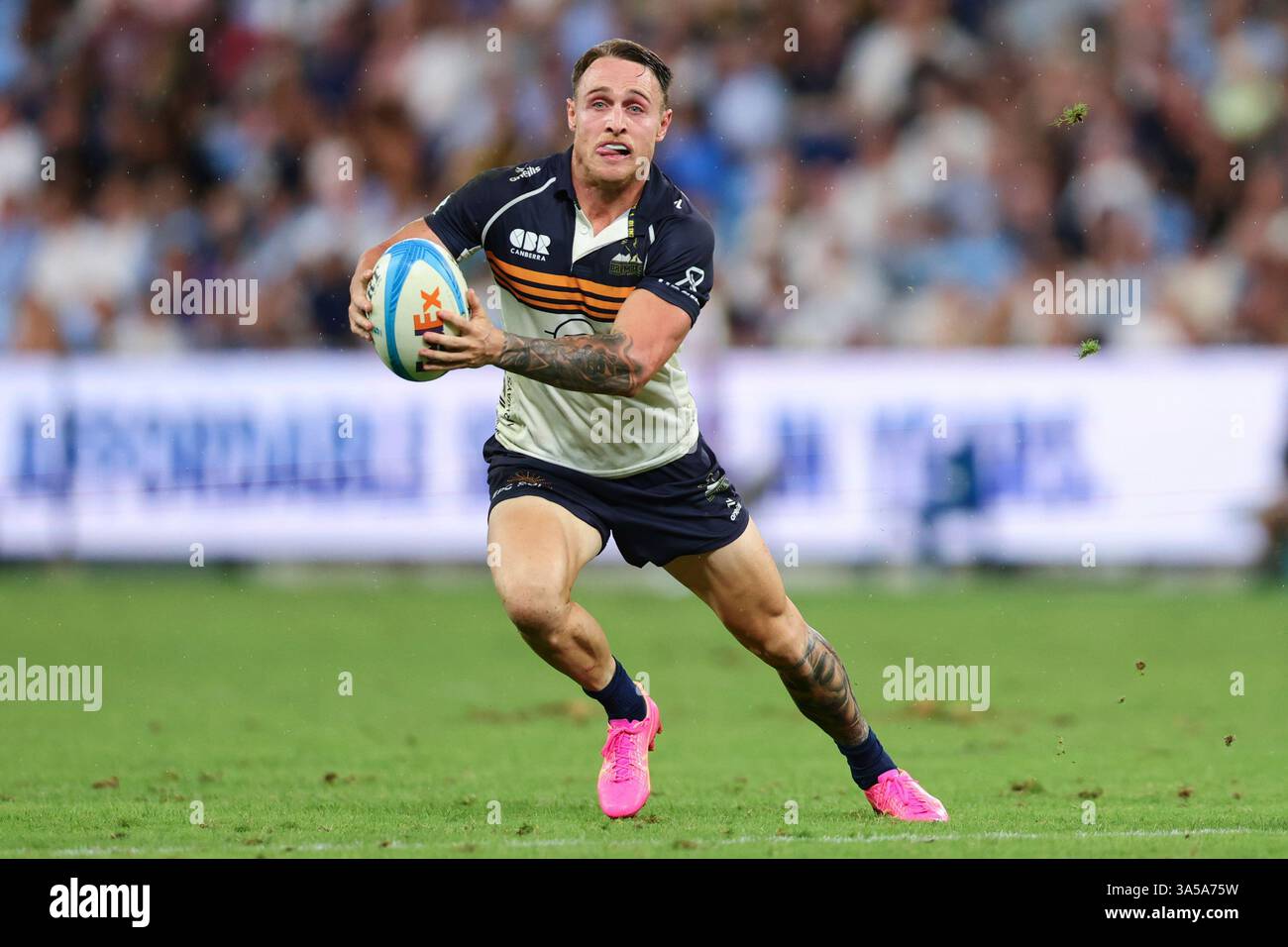 SYDNEY, AUSTRALIA - MARCH 22: Corey Toole of ACT Brumbies runs the ball ...