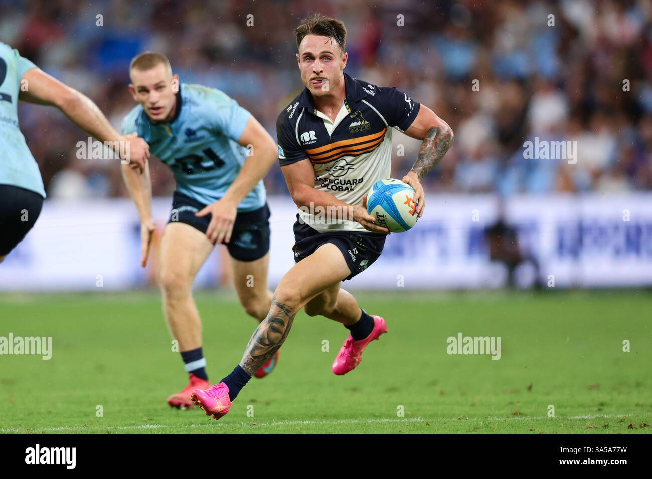 SYDNEY, AUSTRALIA - MARCH 22: Corey Toole of ACT Brumbies runs the ball ...