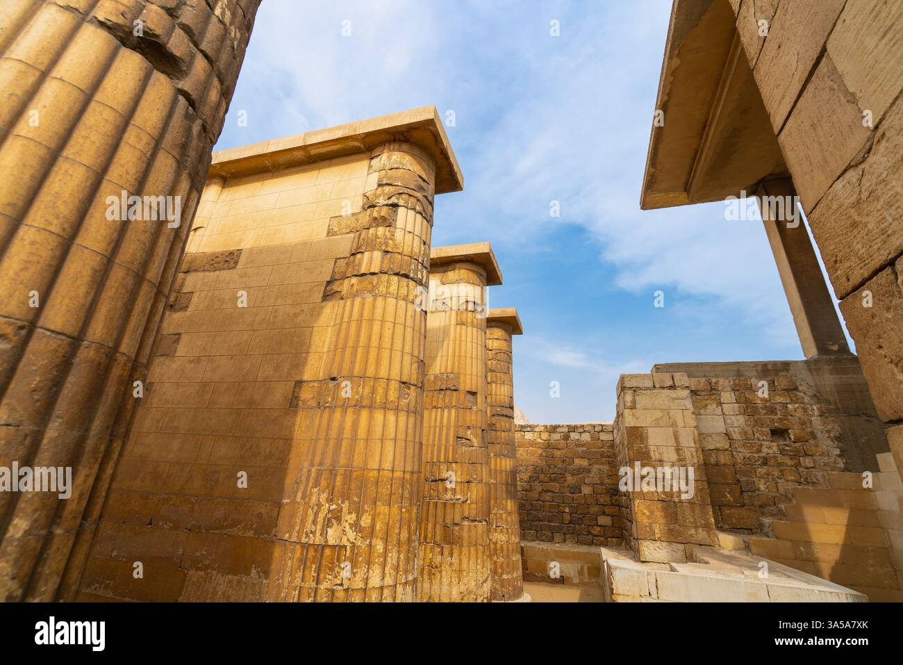 Imposing stone pillars of a temple beside the Step Pyramid of Zoser in ...