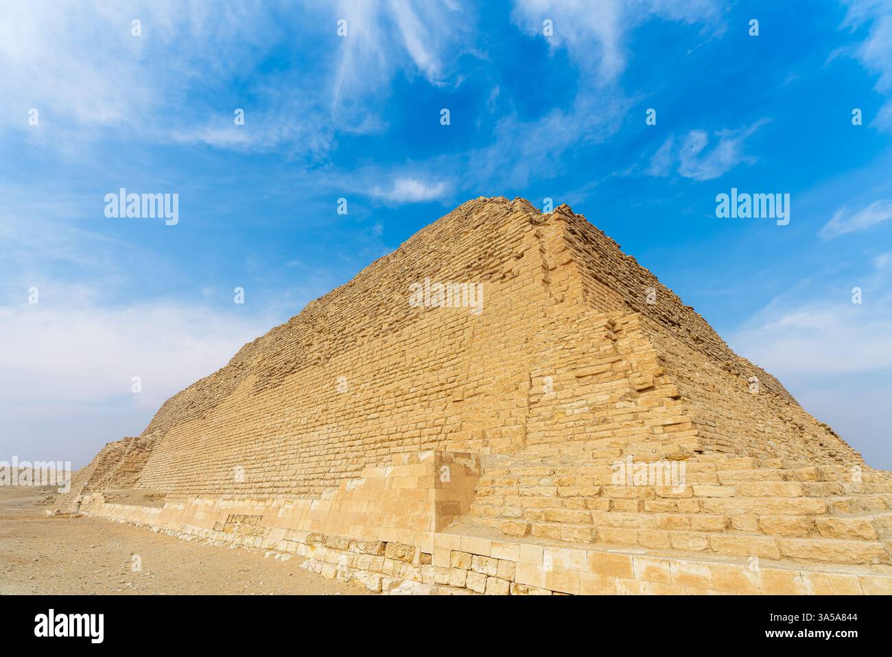 A low-angle view of the Step Pyramid of Zoser, highlighting its layered ...