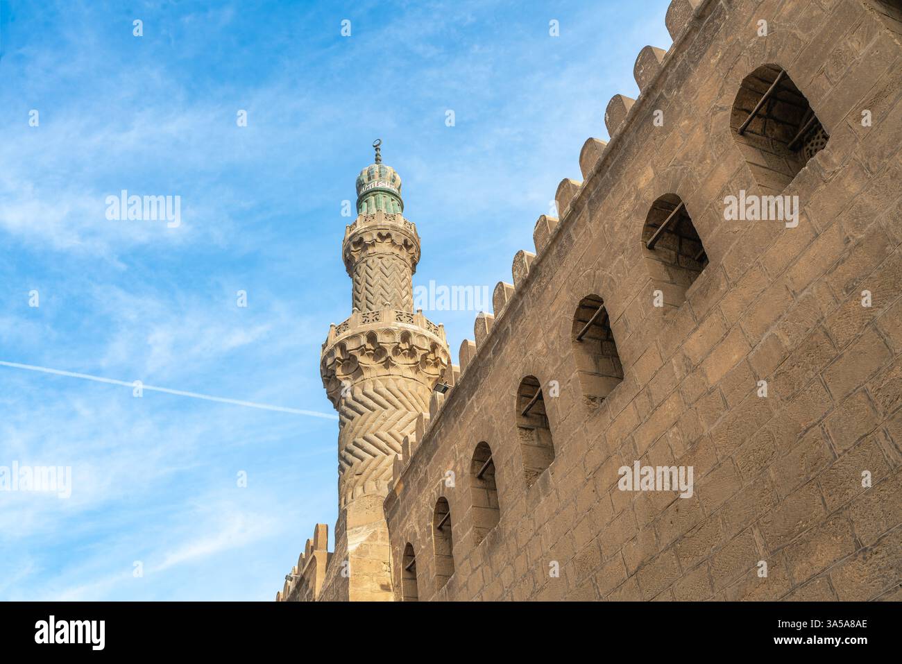 A detailed view of the minaret and stone walls of the Mohamed Ali ...