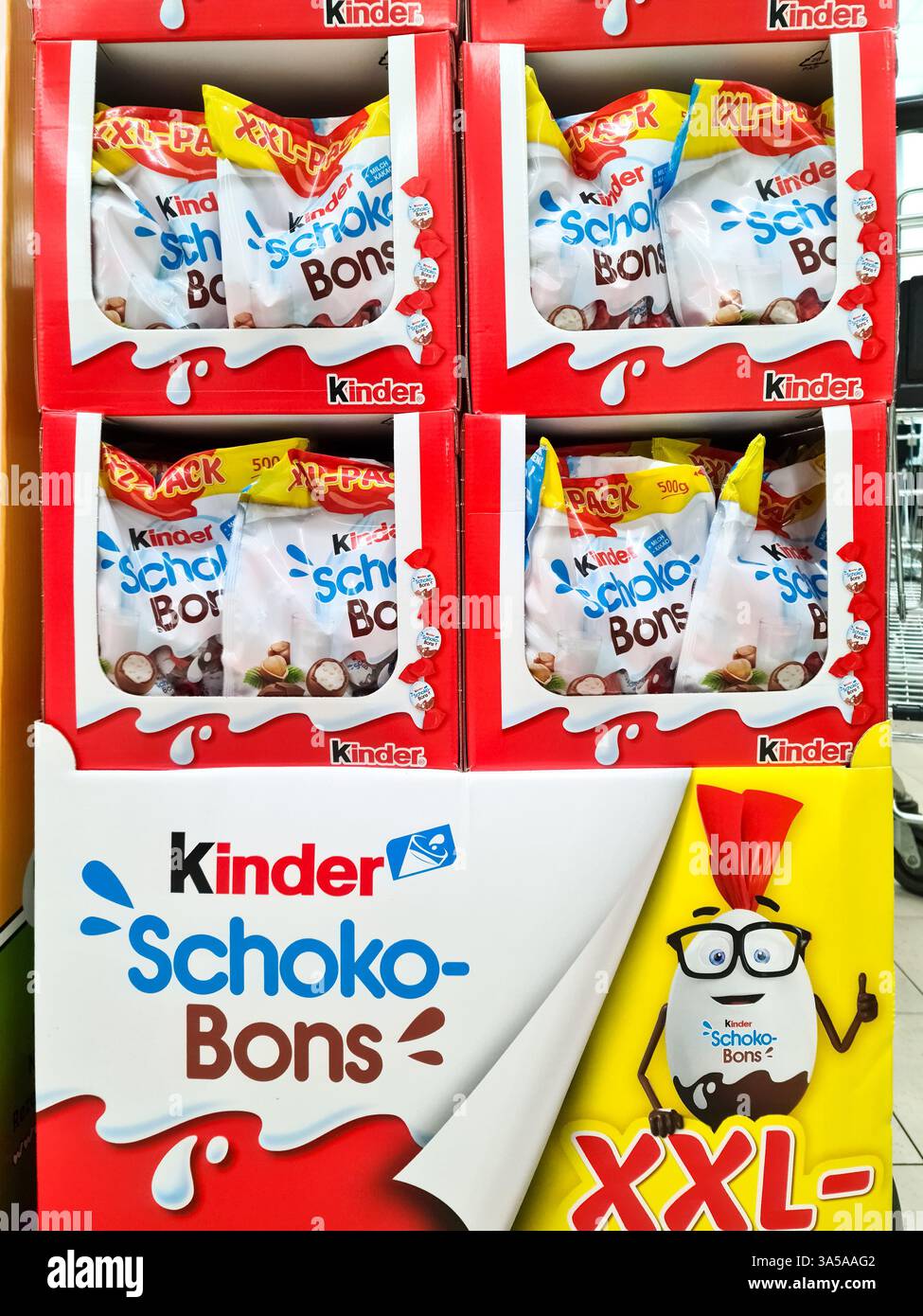 Kiel, Germany 15 March 2025, Boxes of Kinder Schoko Bons candies stacked on a supermarket shelf ...