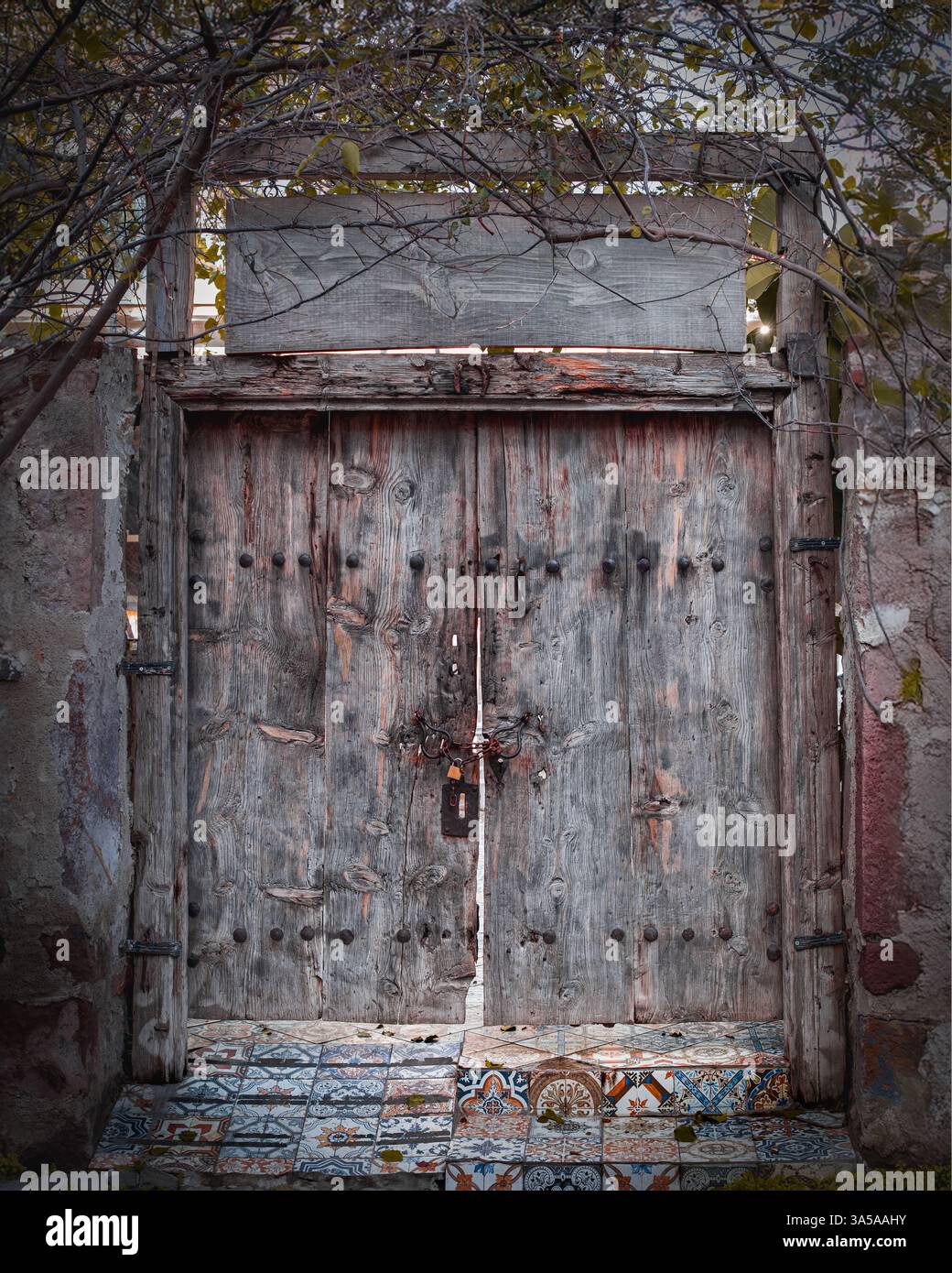 Weathered wooden gate with rustic textures and colorful patterned ...