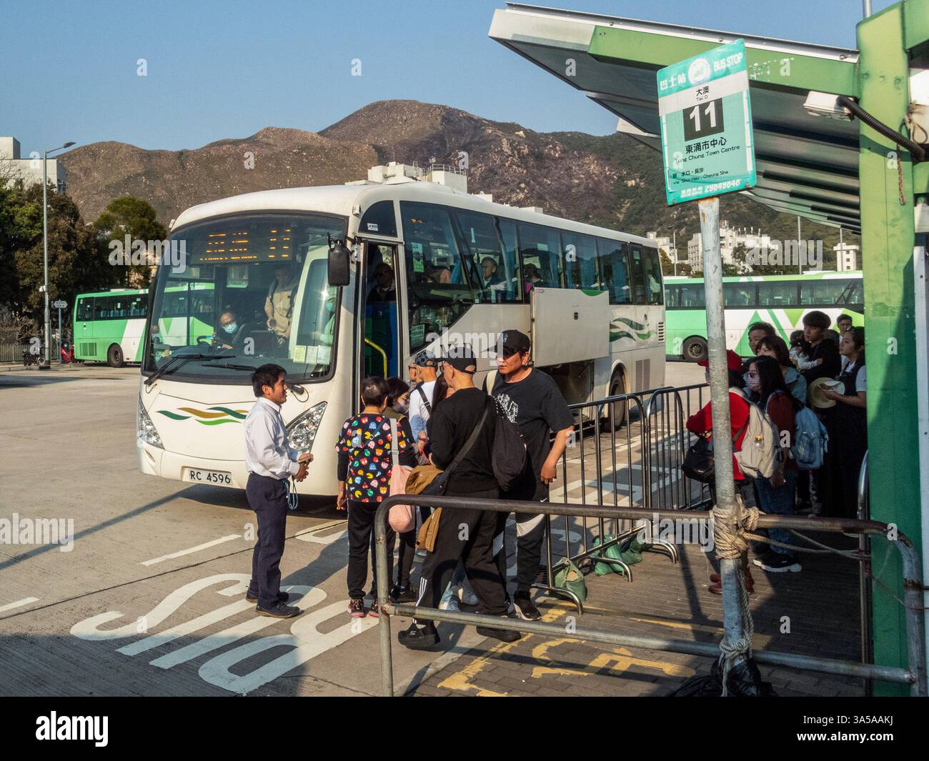 Tourists seen getting on a bus at the bus terminal in Tai O fishing ...