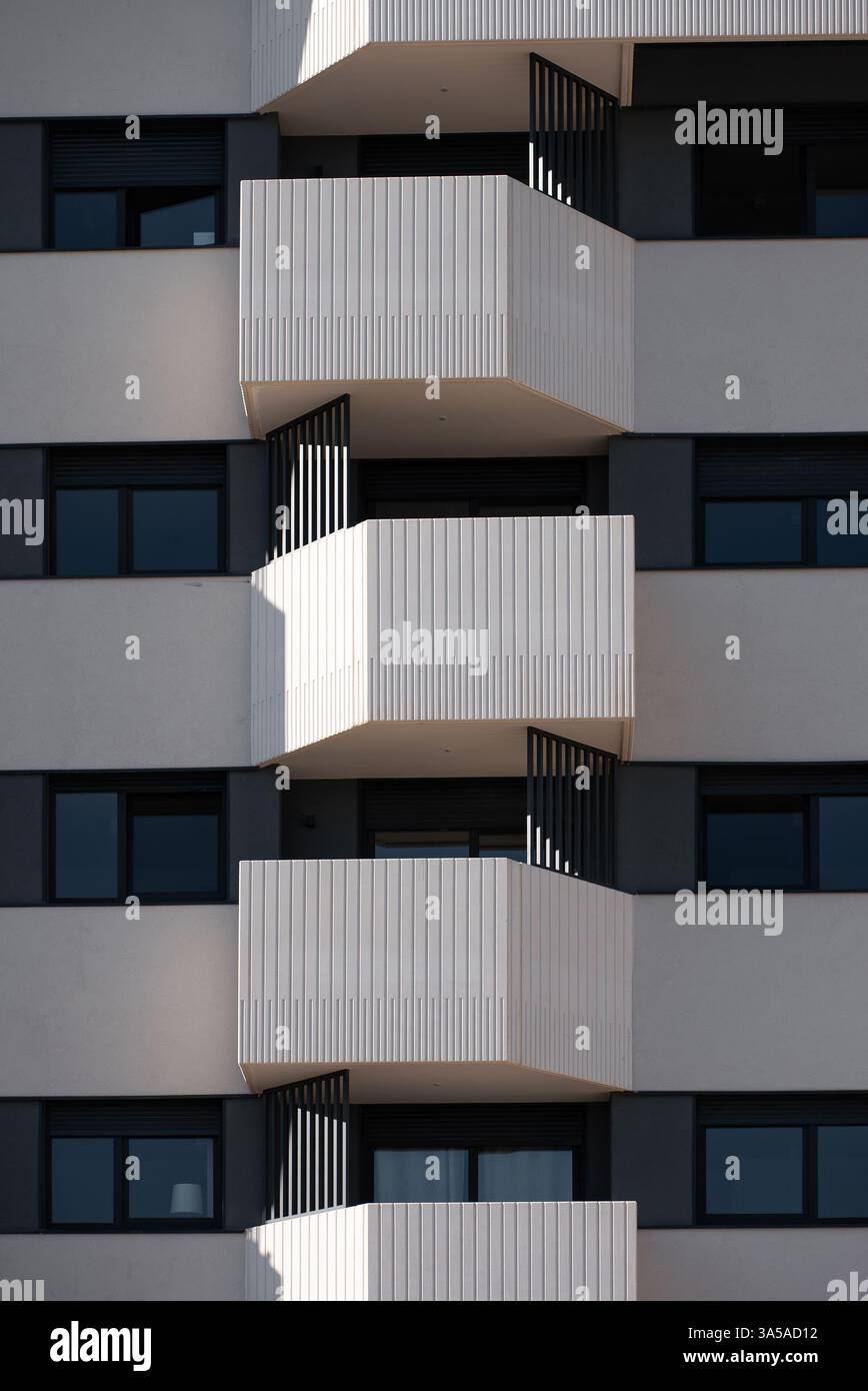 Contemporary building design with balconies and large windows on modern ...