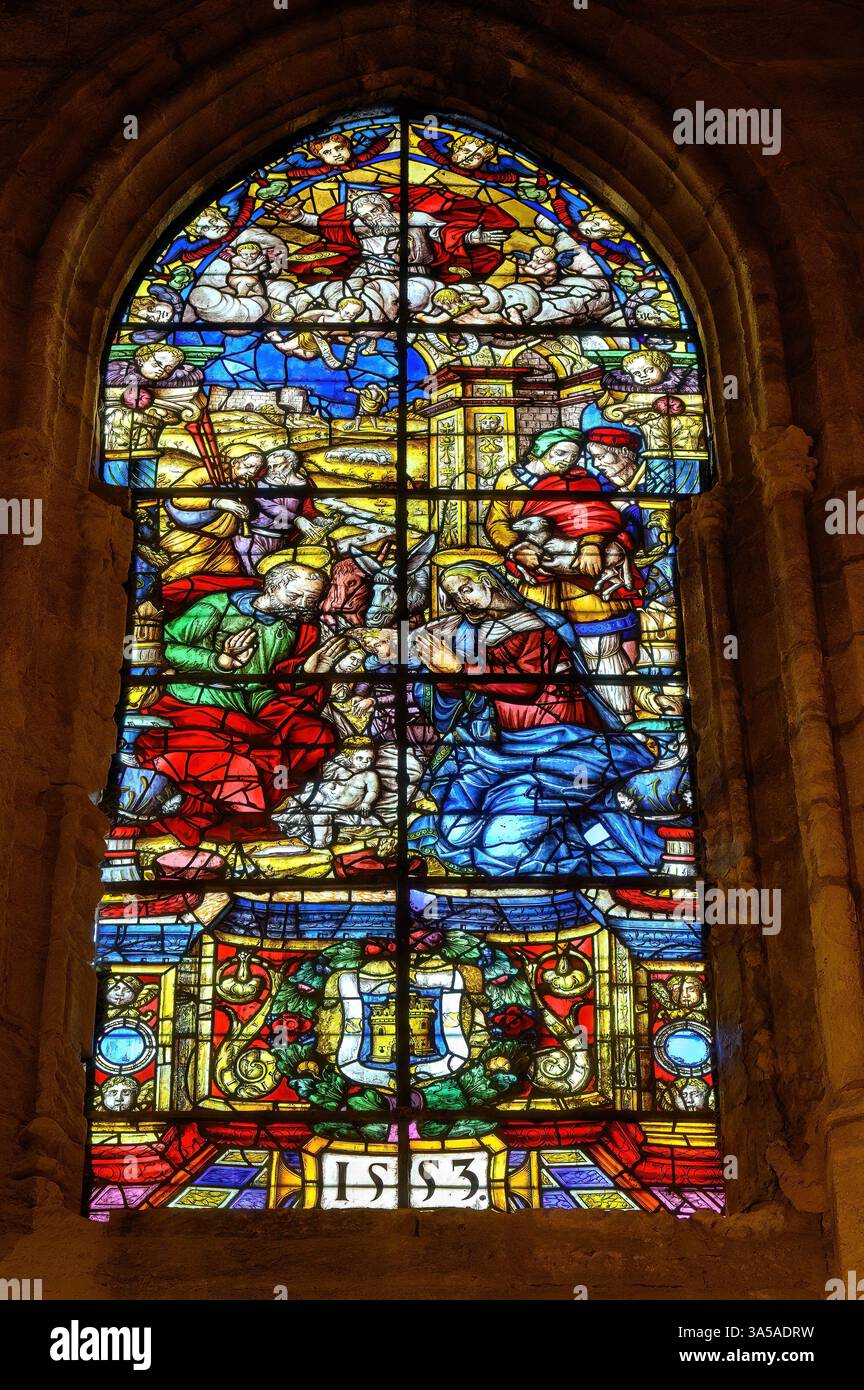 Ancient stained glass window in the interior of the Seville Cathedral ...