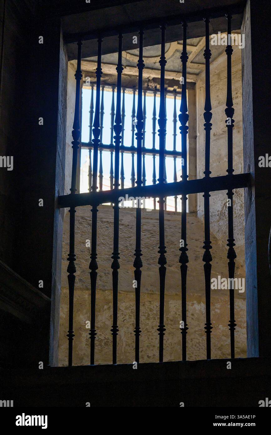 Architectural features of ancient security bars in a window inside the ...