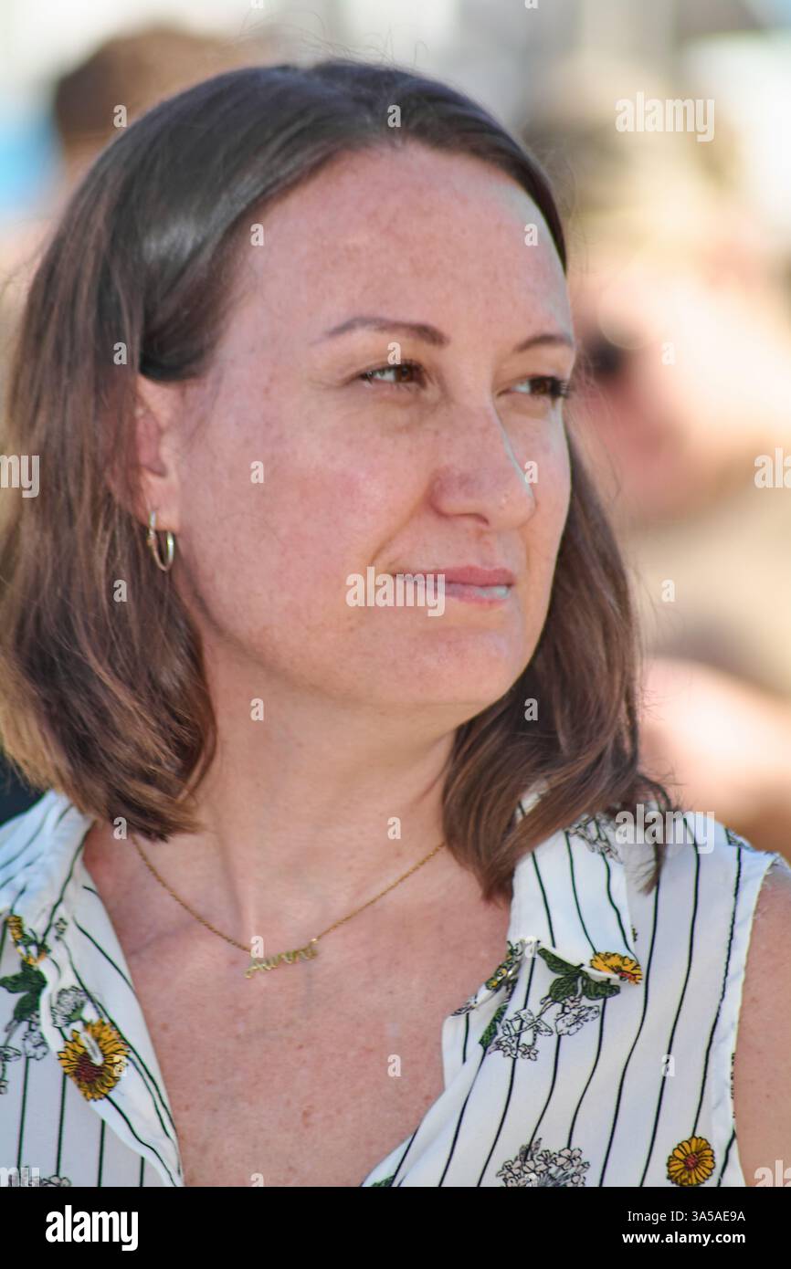 A natural beauty captured in a simple yet elegant pose, wearing minimal ...