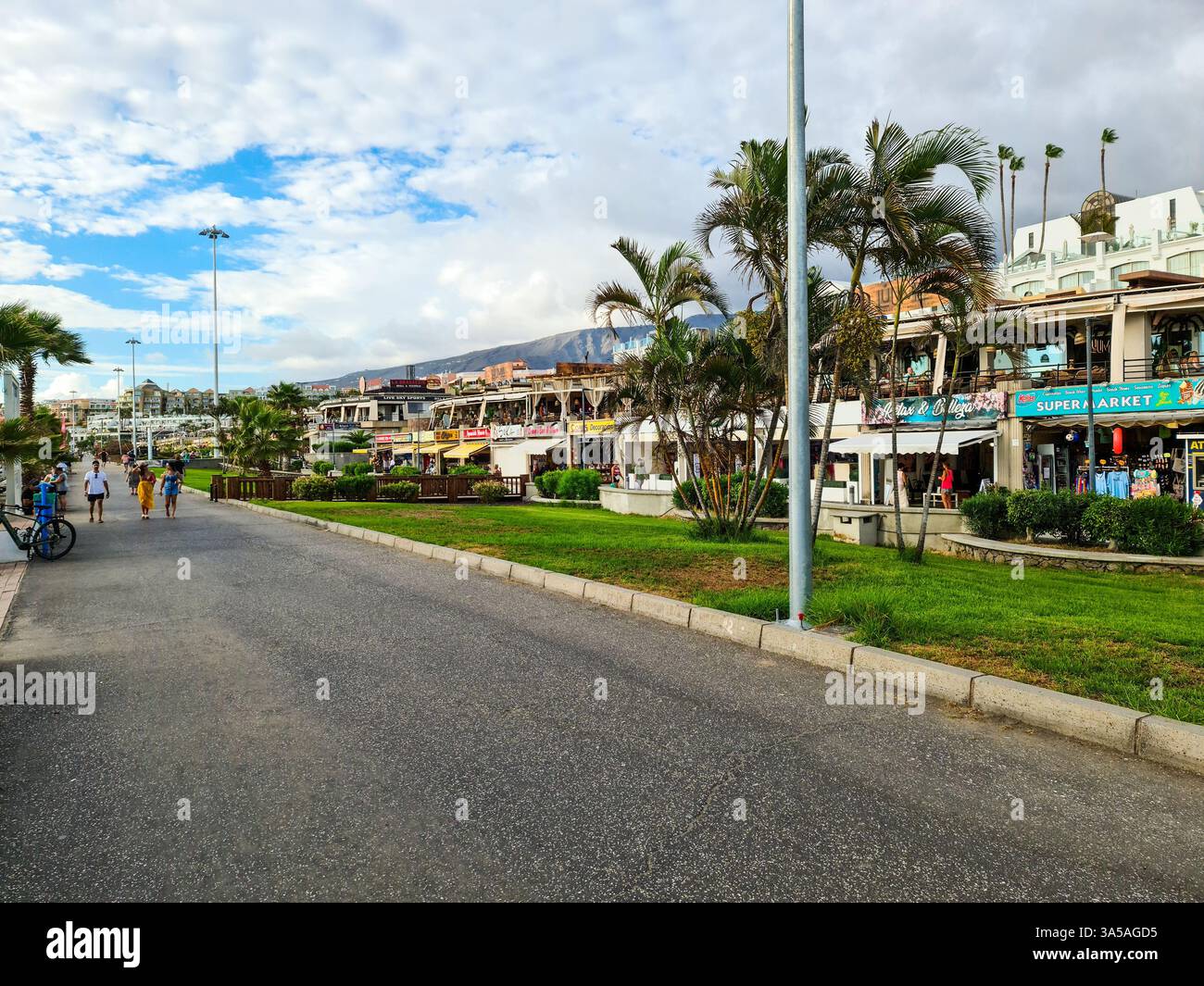 La Calista, Tenerife 18 September 2024, Tourists walking on a paved ...