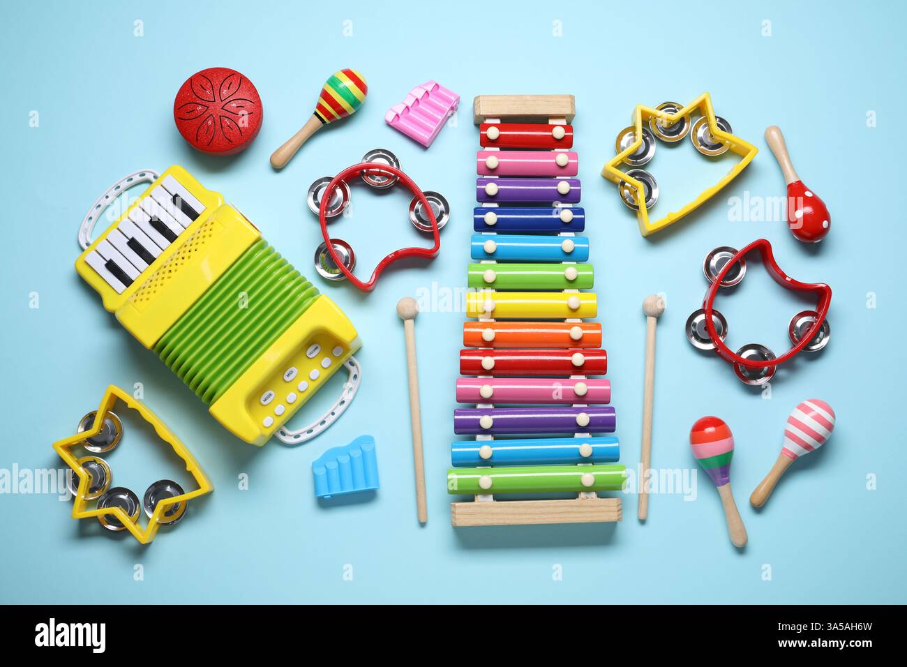Flat lay composition with different toy musical instruments on light ...