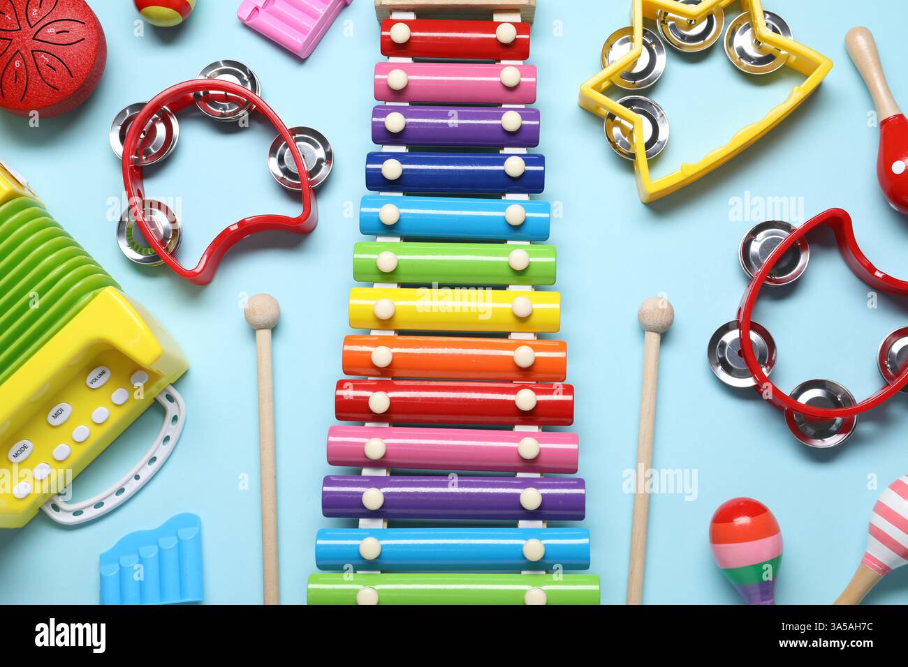 Flat lay composition with different toy musical instruments on light ...