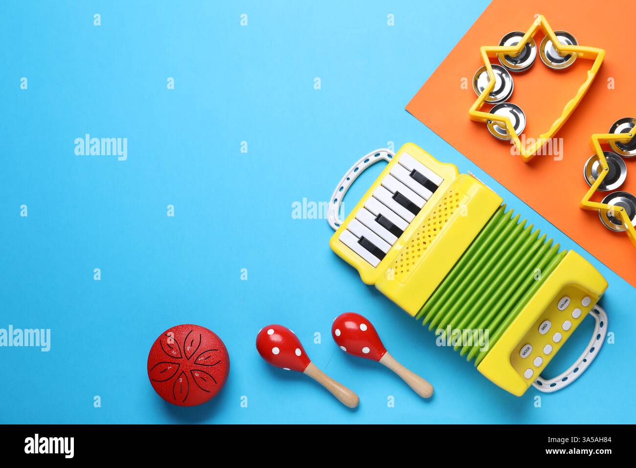 Flat lay composition with different toy musical instruments on color ...