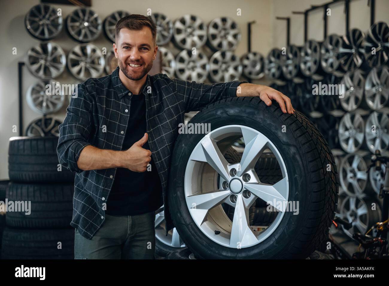 Smiling, positive facial expression, hand gesture. Man worker is ...