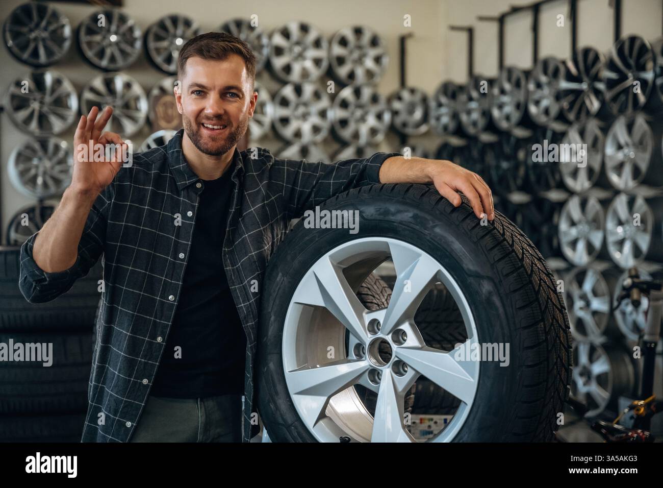 Smiling, positive facial expression, hand gesture. Man worker is ...