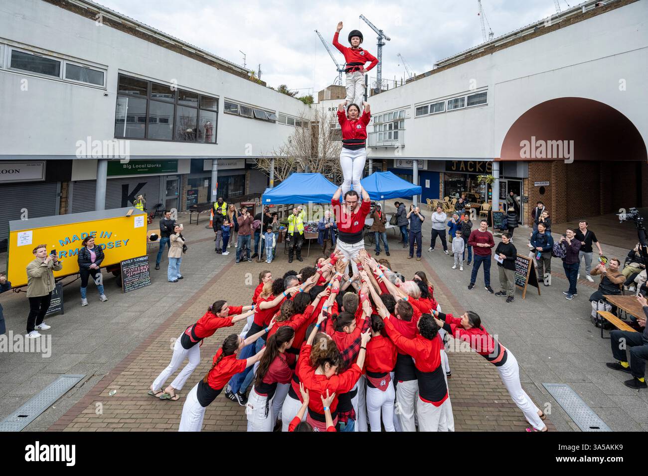 London, UK. 22 March 2025. Members of Castellers of London build ...