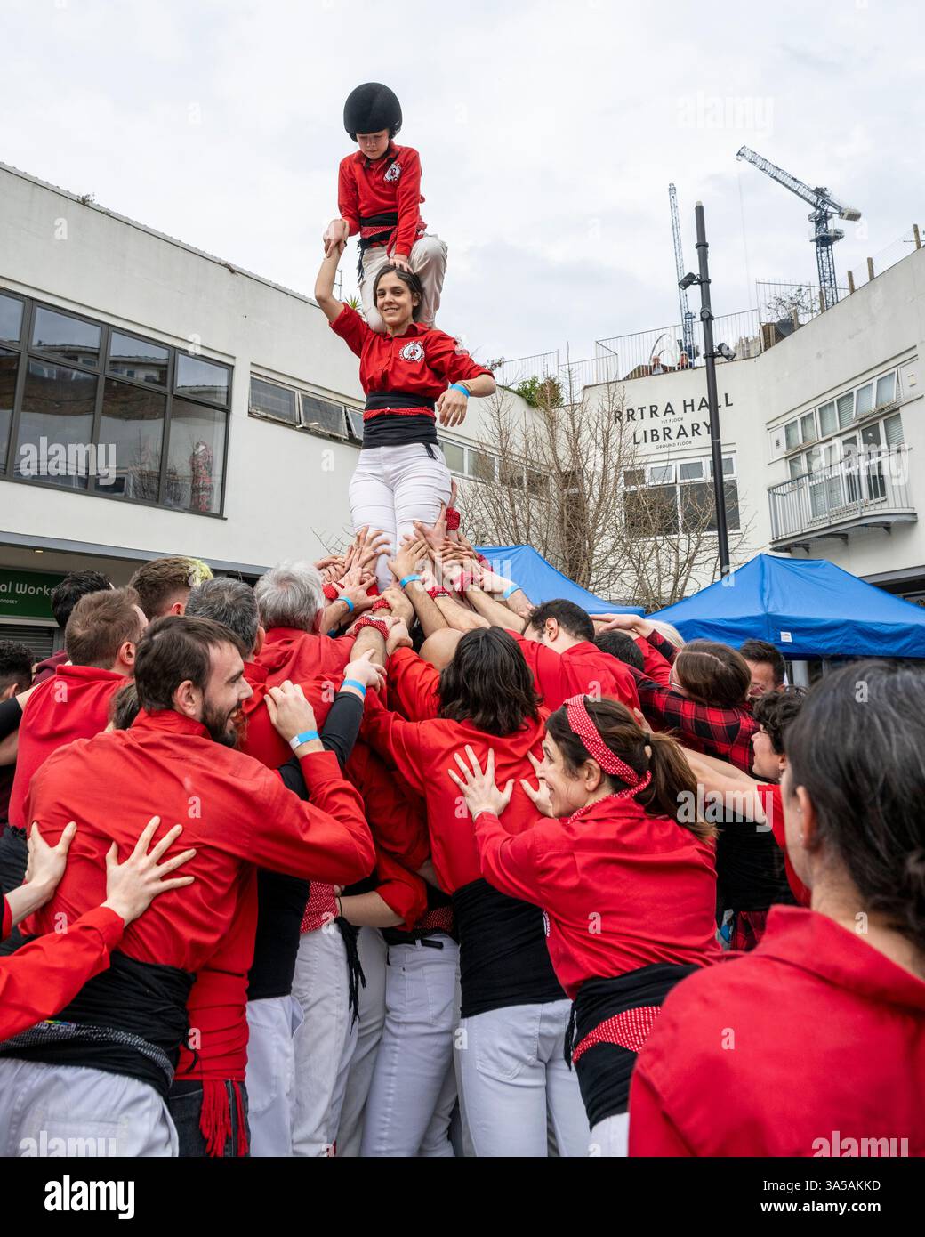 London, UK. 22 March 2025. Members of Castellers of London build ...