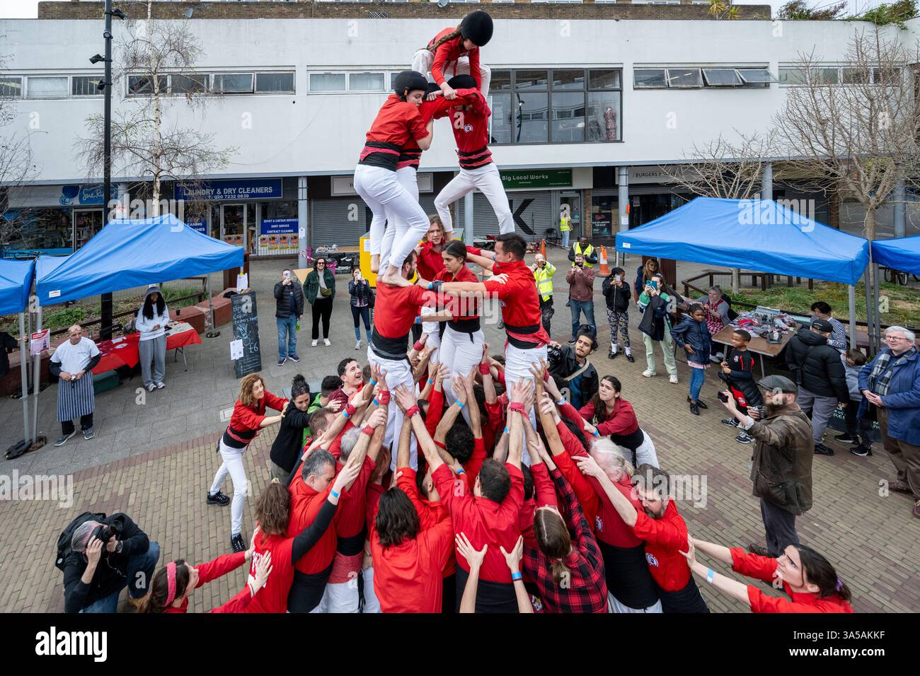 London, UK. 22 March 2025. Members of Castellers of London build ...