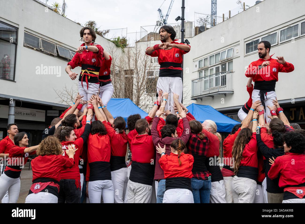 London, UK. 22 March 2025. Members of Castellers of London build ...