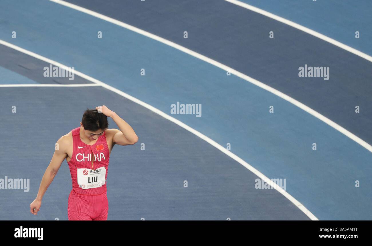 Nanjing, China's Jiangsu Province. 22nd Mar, 2025. Third placed Liu Junxi of China reacts after ...