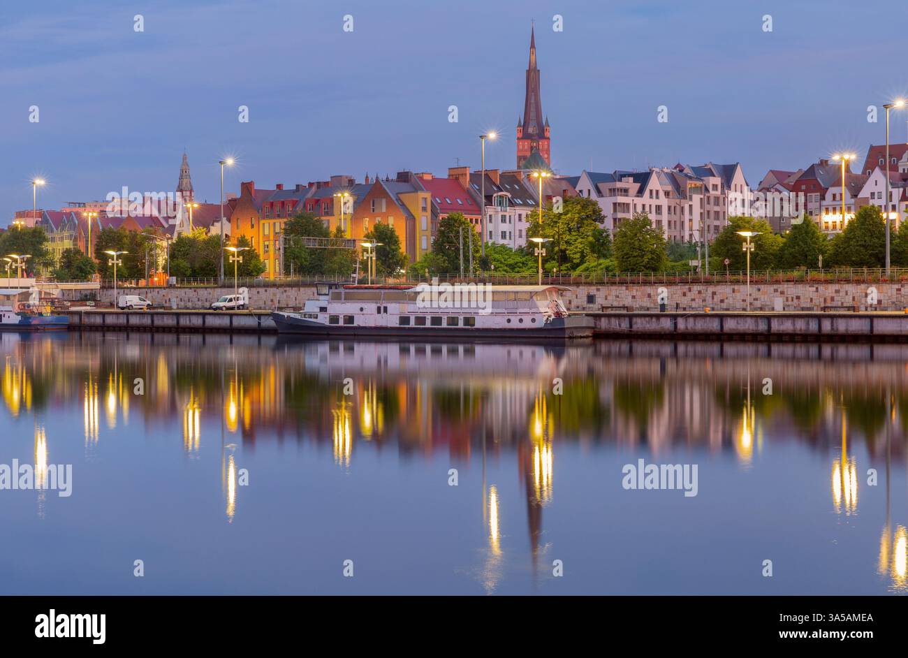Oder River waterfront in Szczecin Poland with illuminated buildings and ...