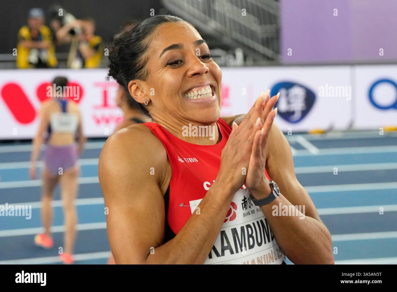 Mujinga Kambundji, of Switzerland, reacts after winning the gold medal ...