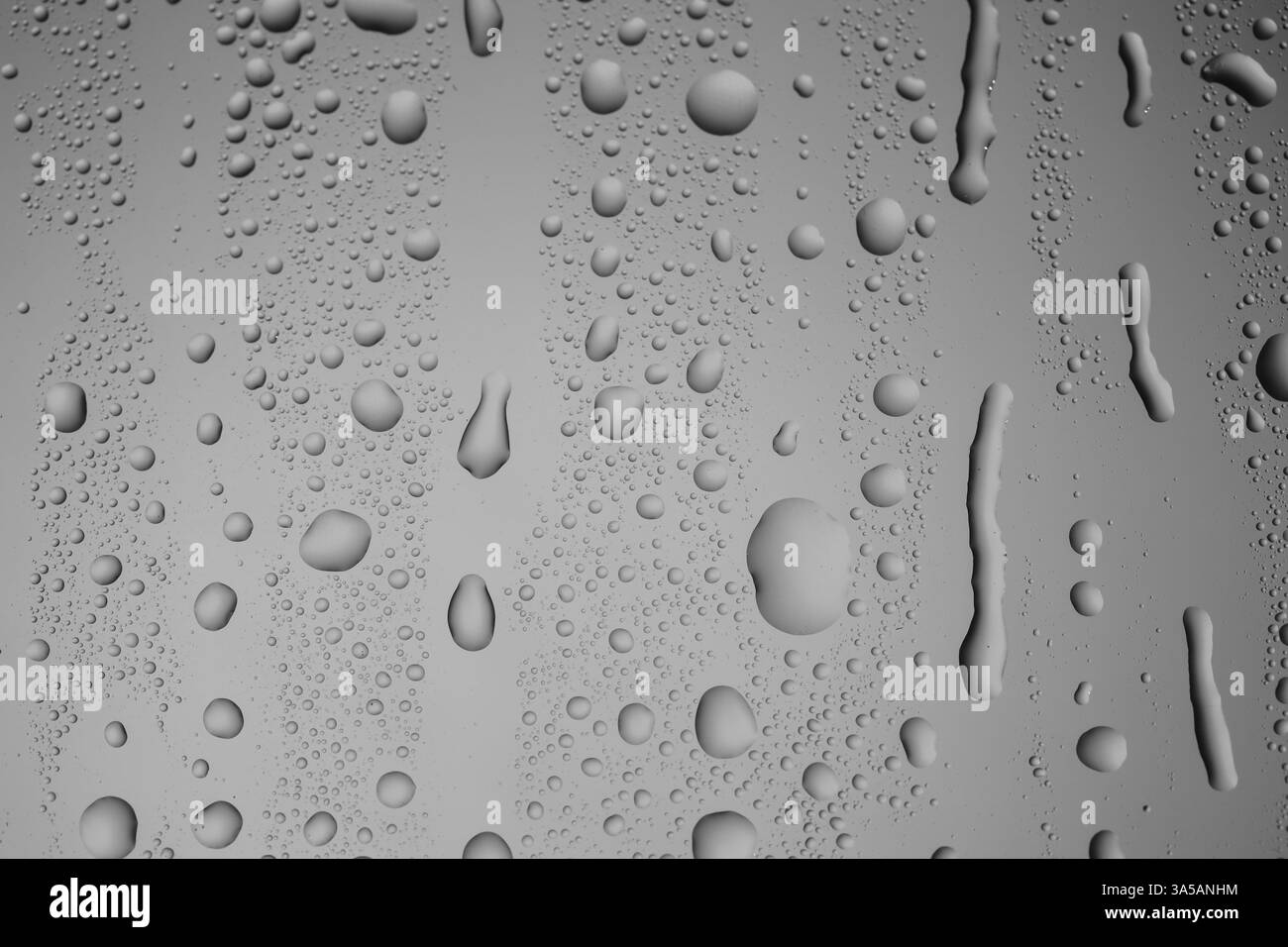 Water drops on grey glass surface, closeup Stock Photo - Alamy
