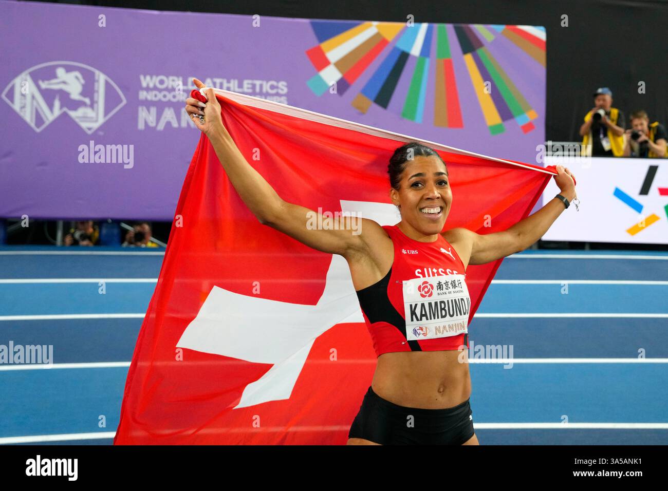 Mujinga Kambundji, of Switzerland, celebrates after winning the gold ...