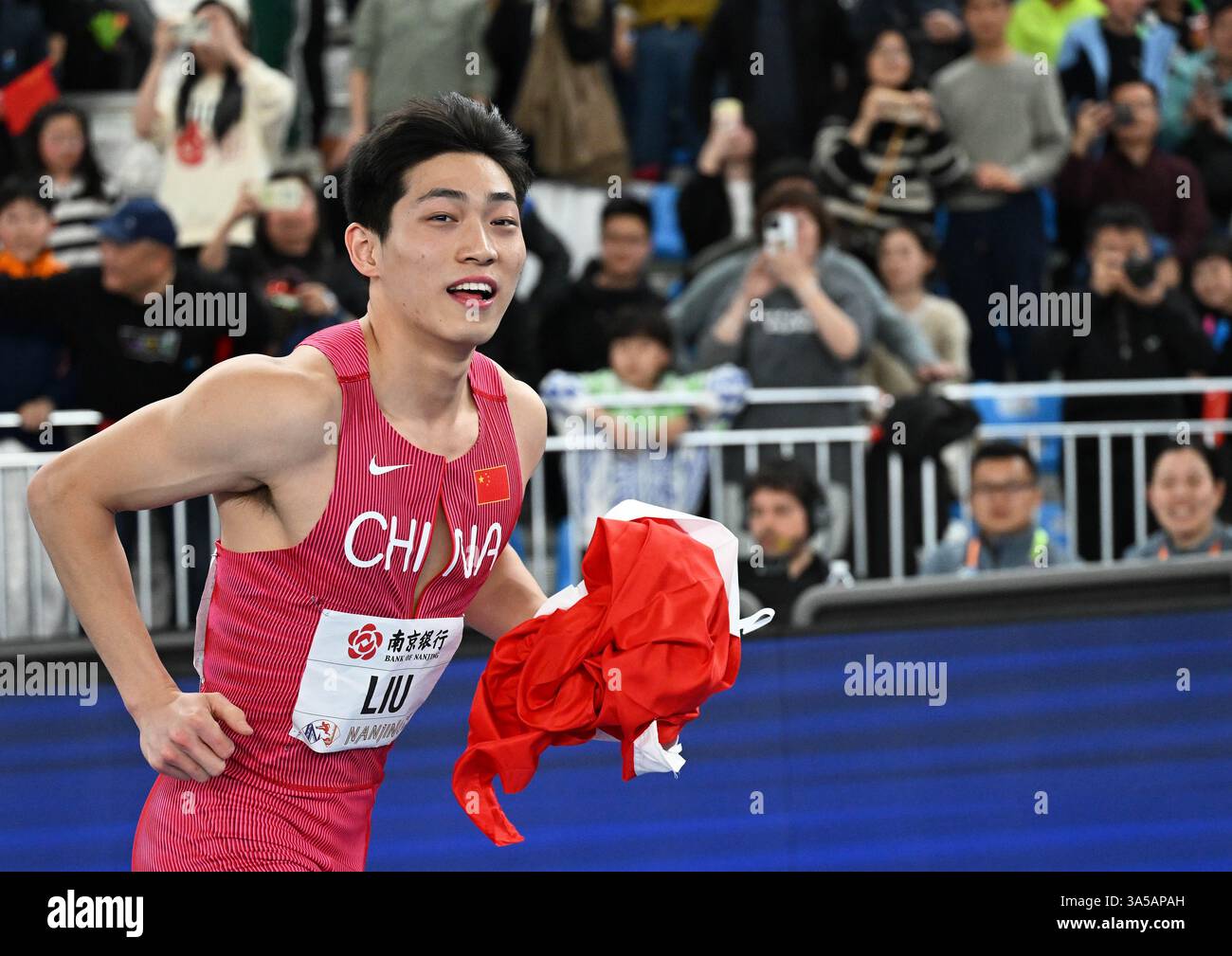 Nanjing, China's Jiangsu Province. 22nd Mar, 2025. Third placed Liu Junxi of China reacts after ...