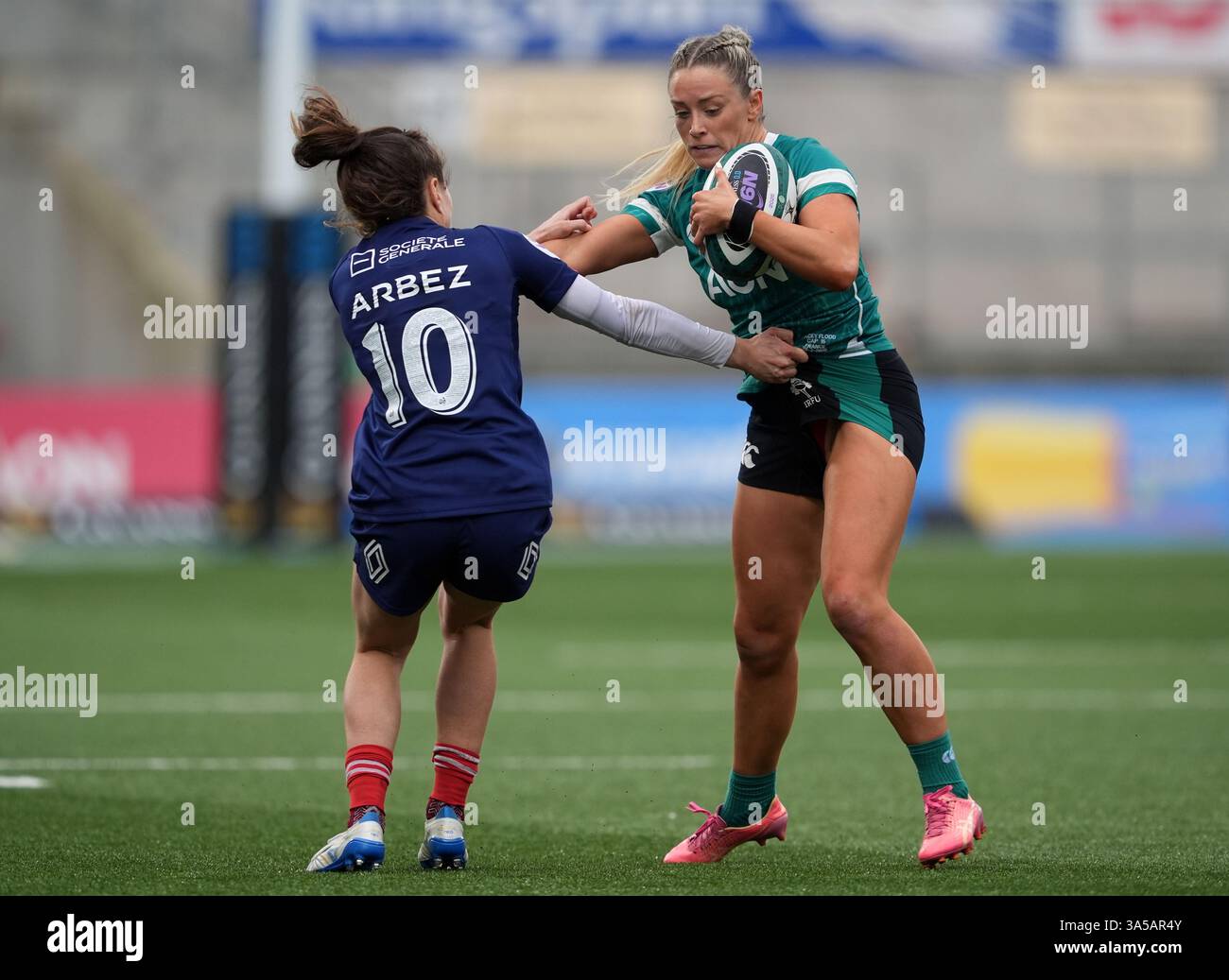 France's Dannah O'Brien (left) and Ireland's Stacey Flood in action ...