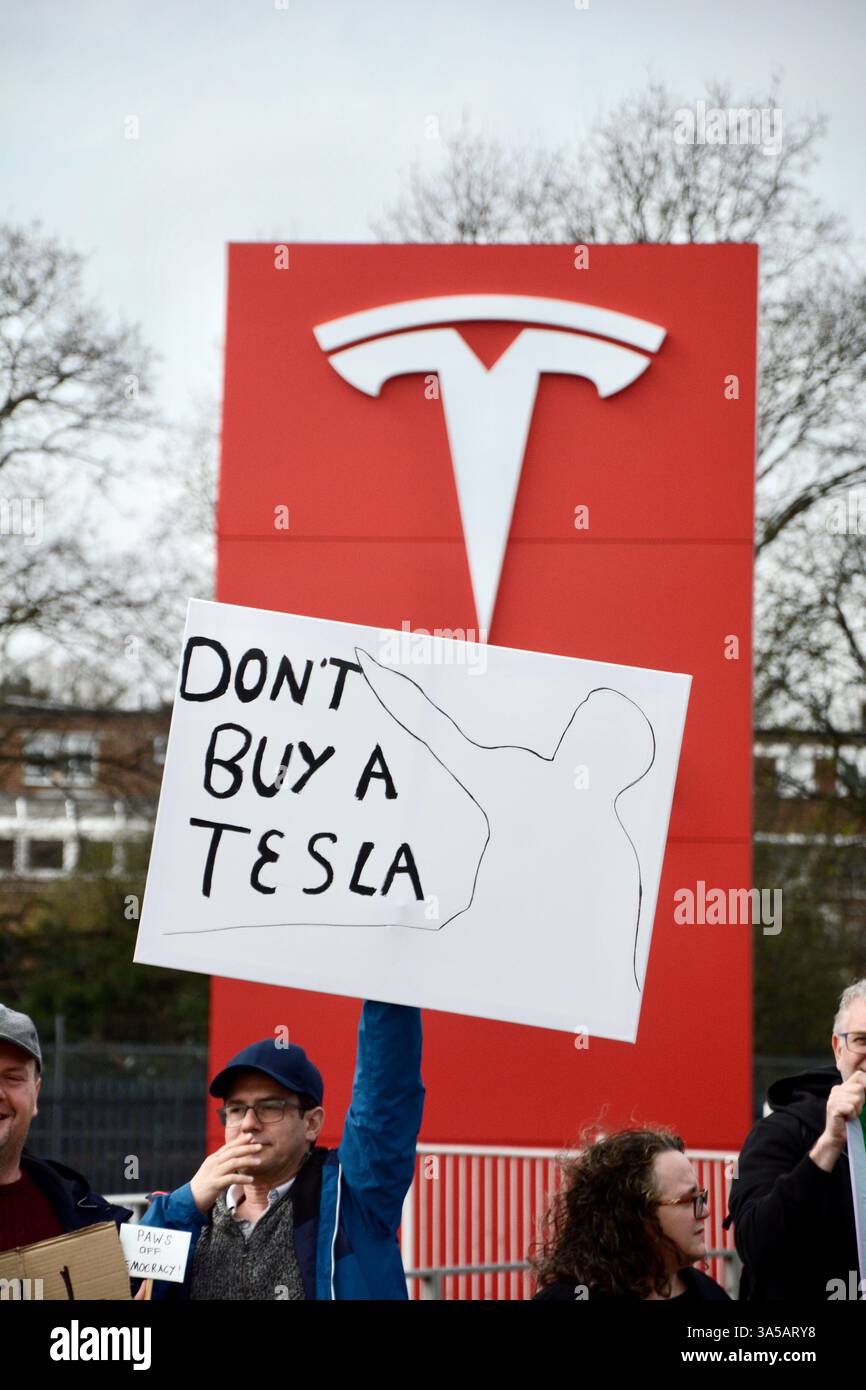 Anti Tesla demonstrators protest outside a Tesla centre showroom at ...
