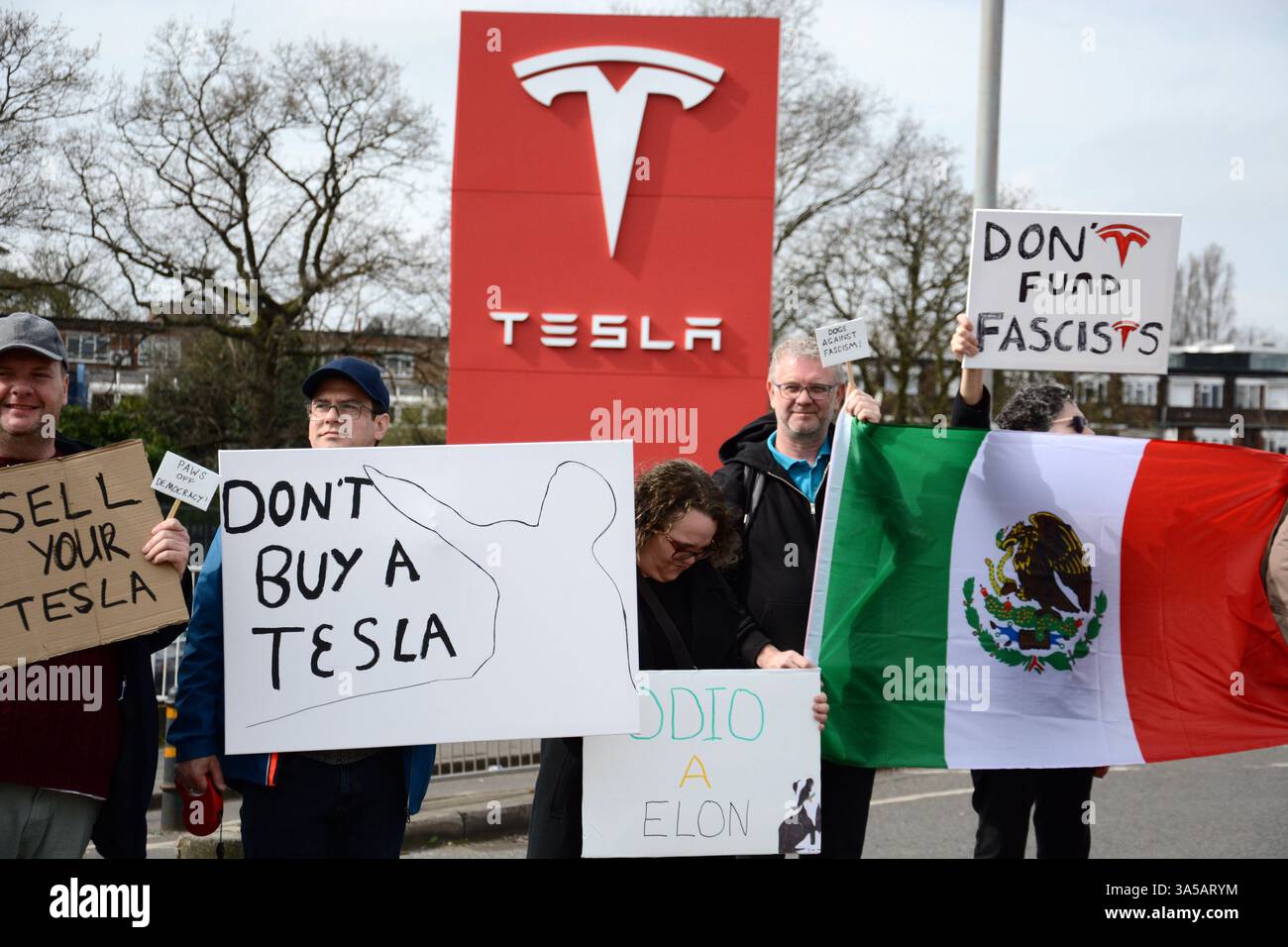 Anti Tesla demonstrators protest outside a Tesla centre showroom at ...