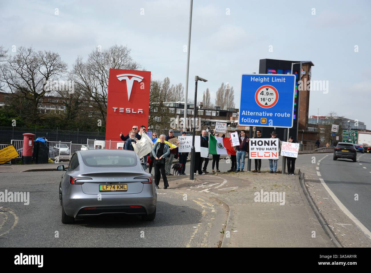 Anti Tesla demonstrators protest outside a Tesla centre showroom at ...