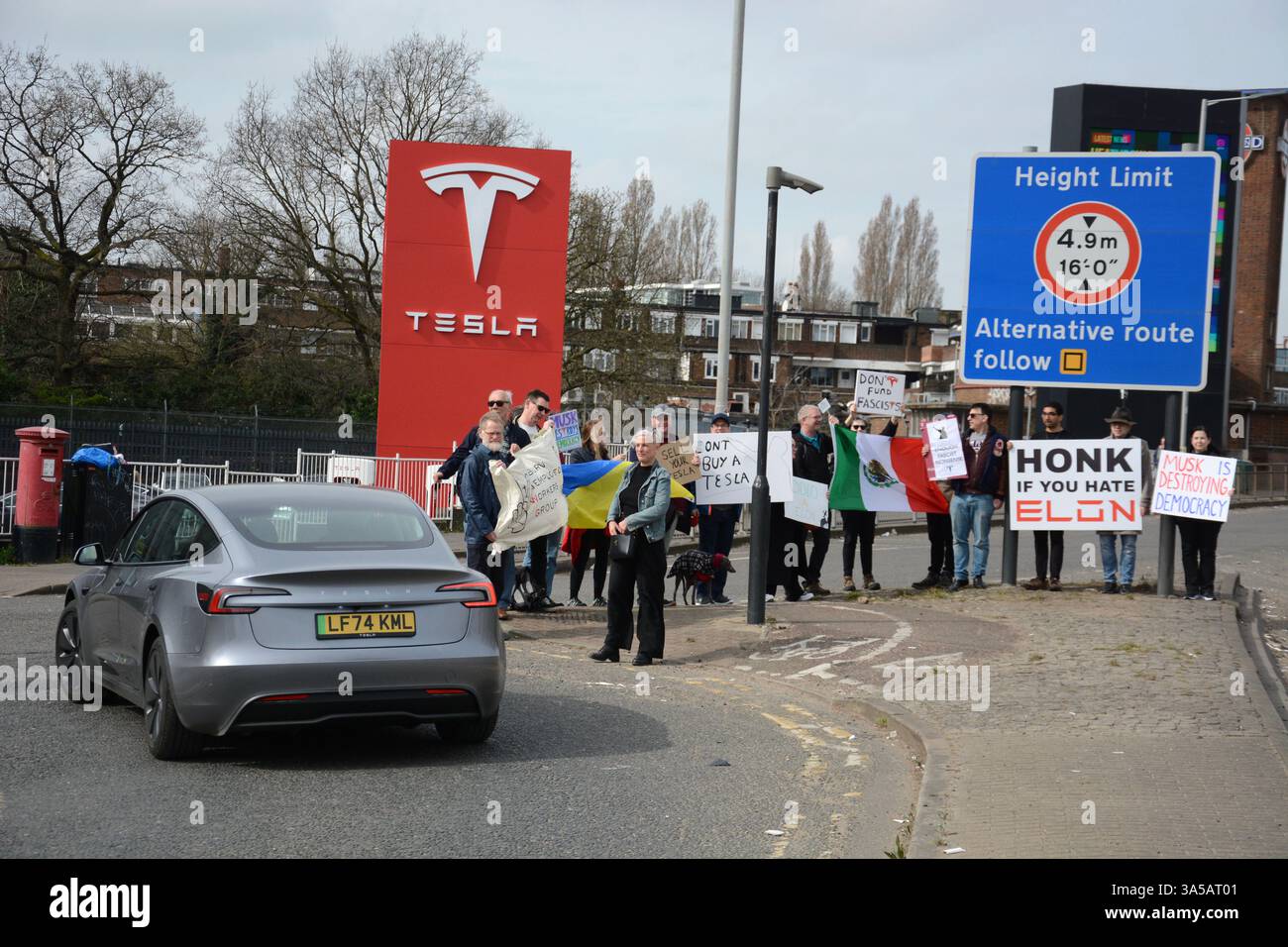 Anti Tesla demonstrators protest outside a Tesla centre showroom at ...