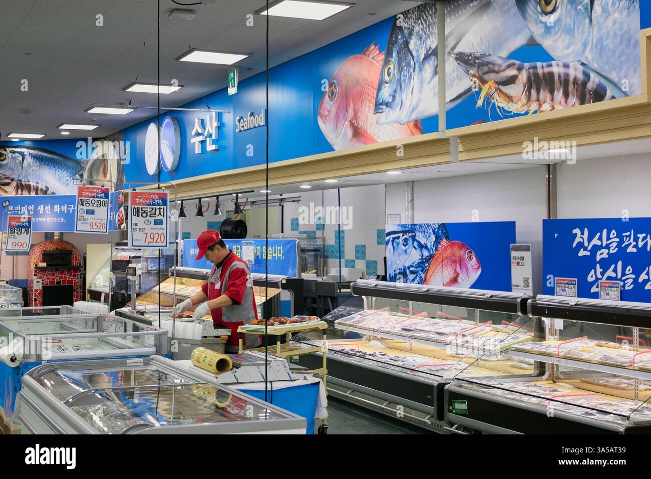 Seafood counter in a Korean grocery store featuring fresh fish, shrimp ...
