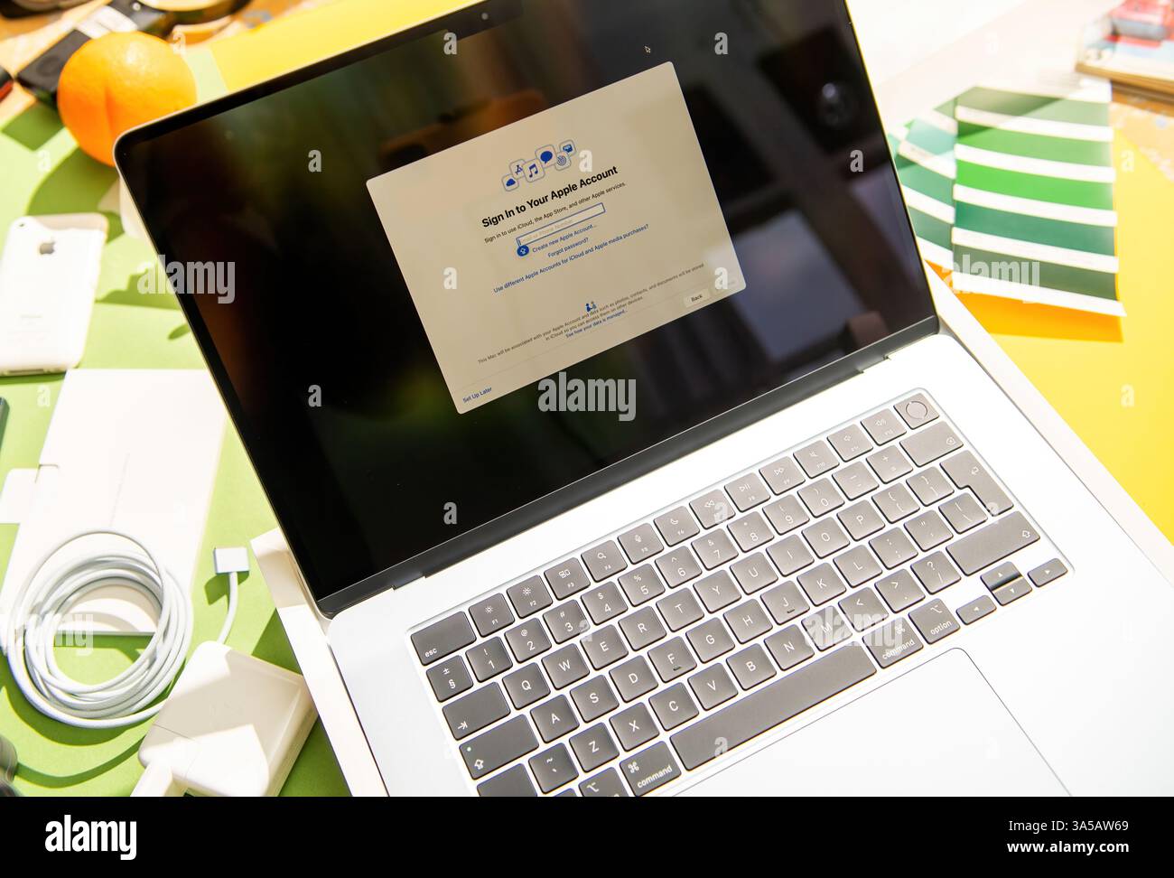 Paris, France - Mar 13, 2025: MacBook Air M4 is shown during initial setup process with Apple ID ...