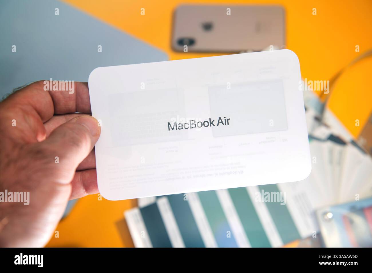 Paris, France - Mar 13, 2025: A printed MacBook Air M4 startup document ...